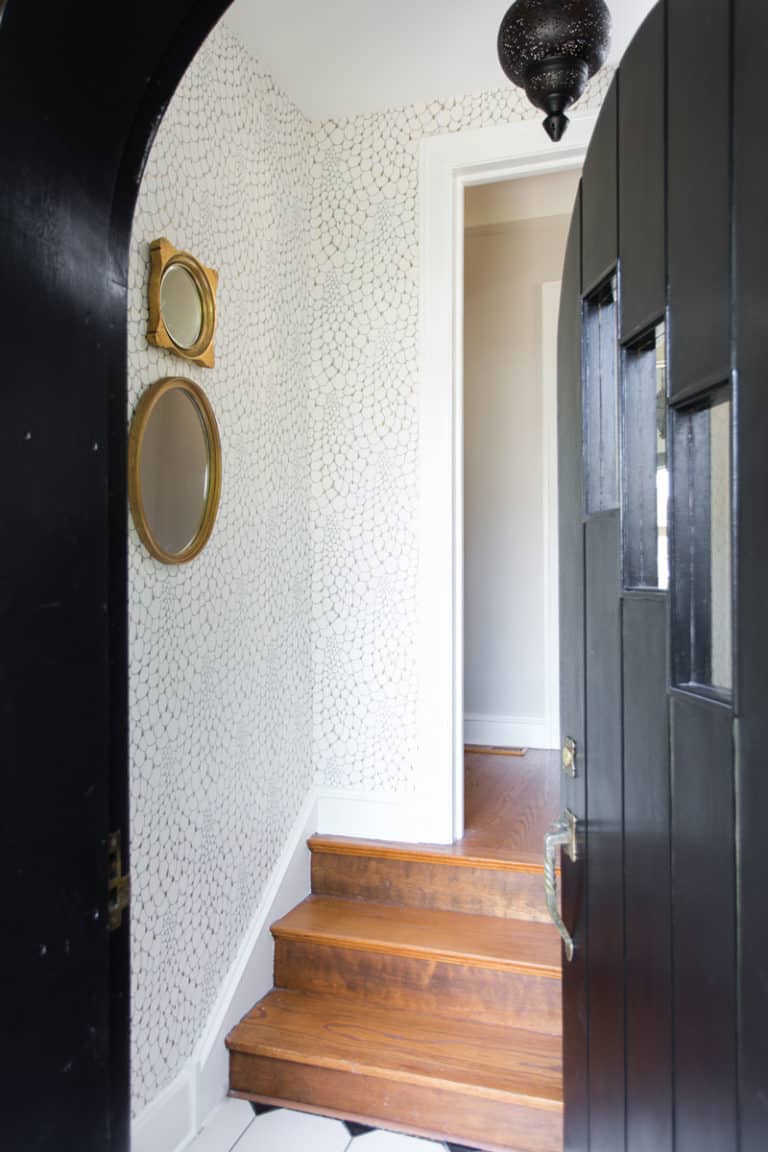 Entry with Black Door and Wallpaper