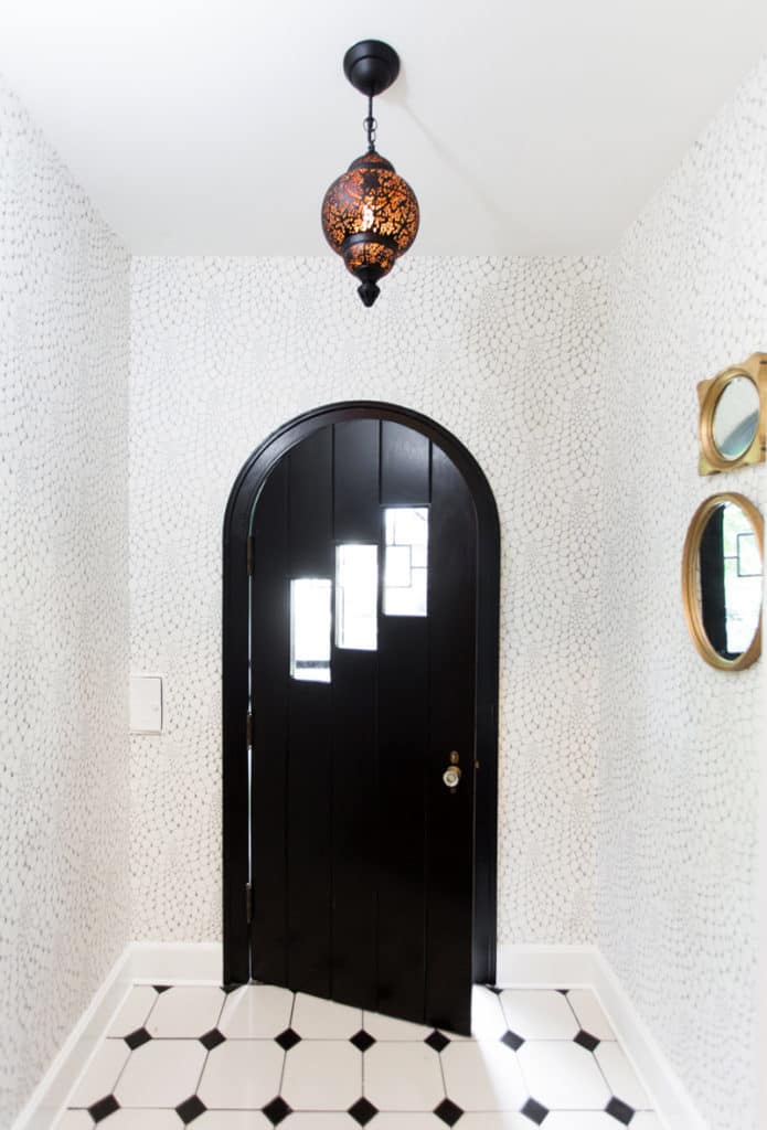 Entry with Black Door and Wallpaper